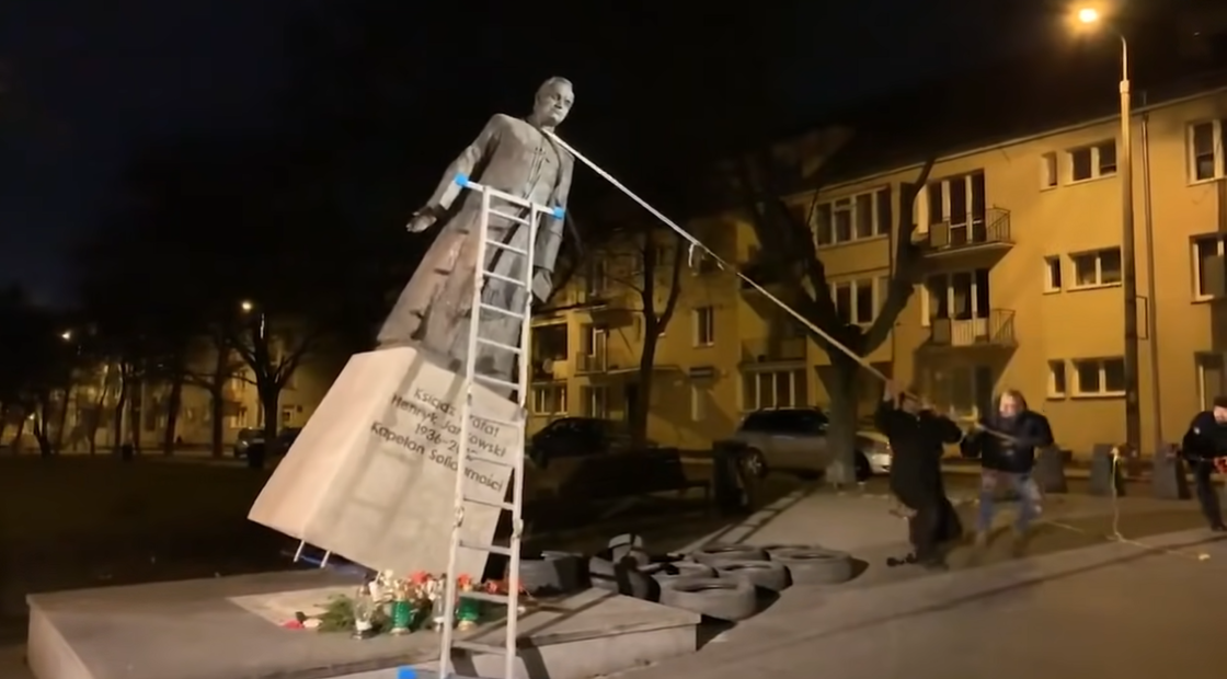 Court acquits men who toppled statue of Polish priest accused of child ...